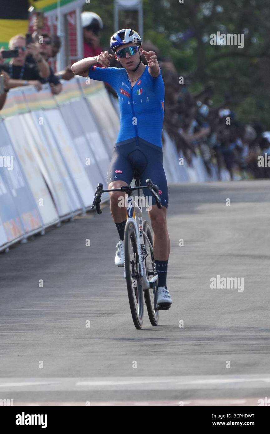 Italy's Mark Lorenzo Finn celebrates as he crosses the finish line to ...
