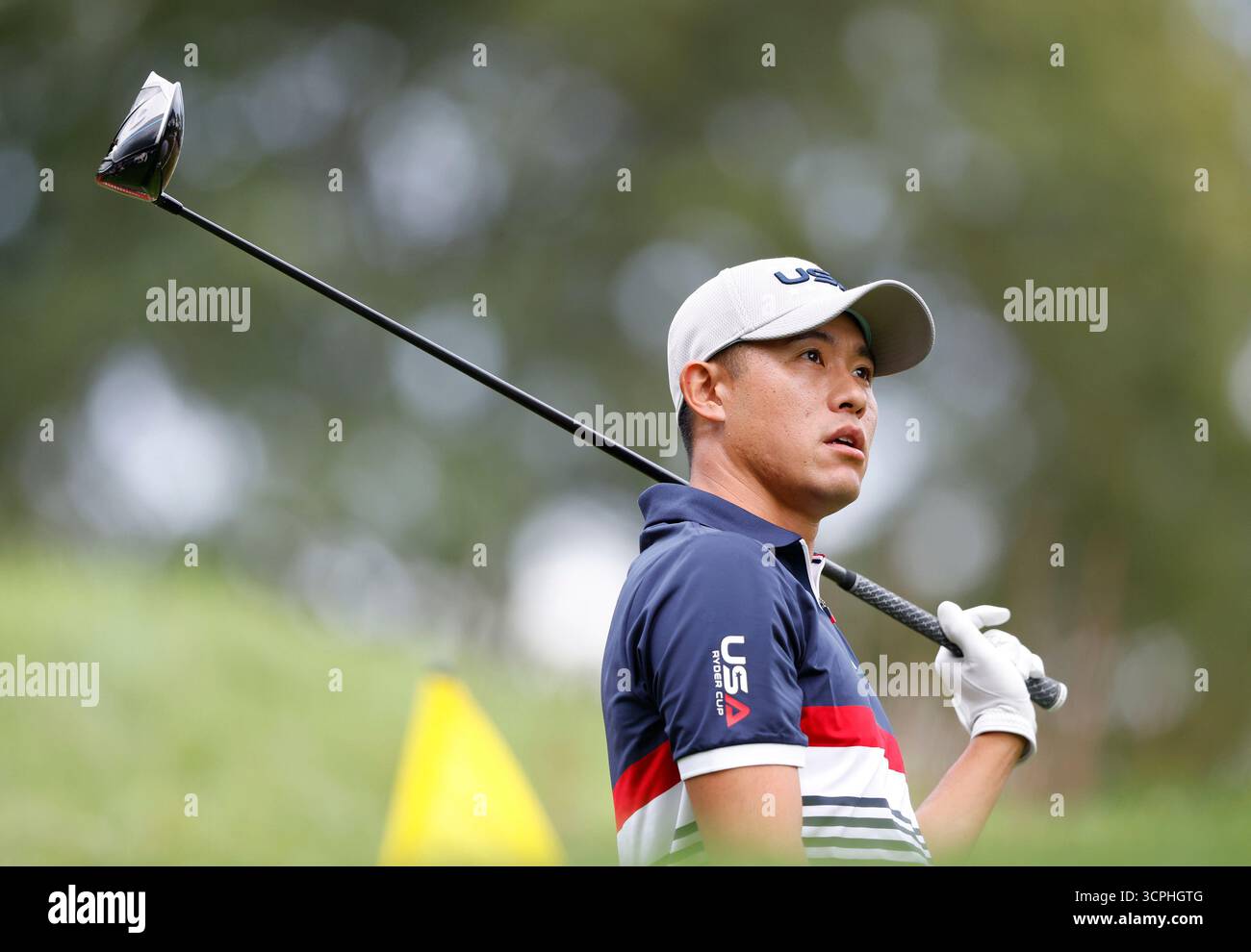 Colin Morikawa of team Unites States reacts after his tee shot on the ...