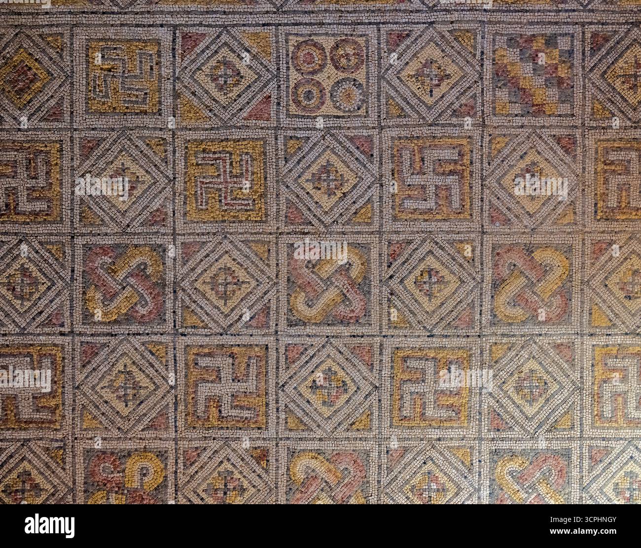 Ancient mosaic floor with geometric patterns and symbols Stock Photo ...