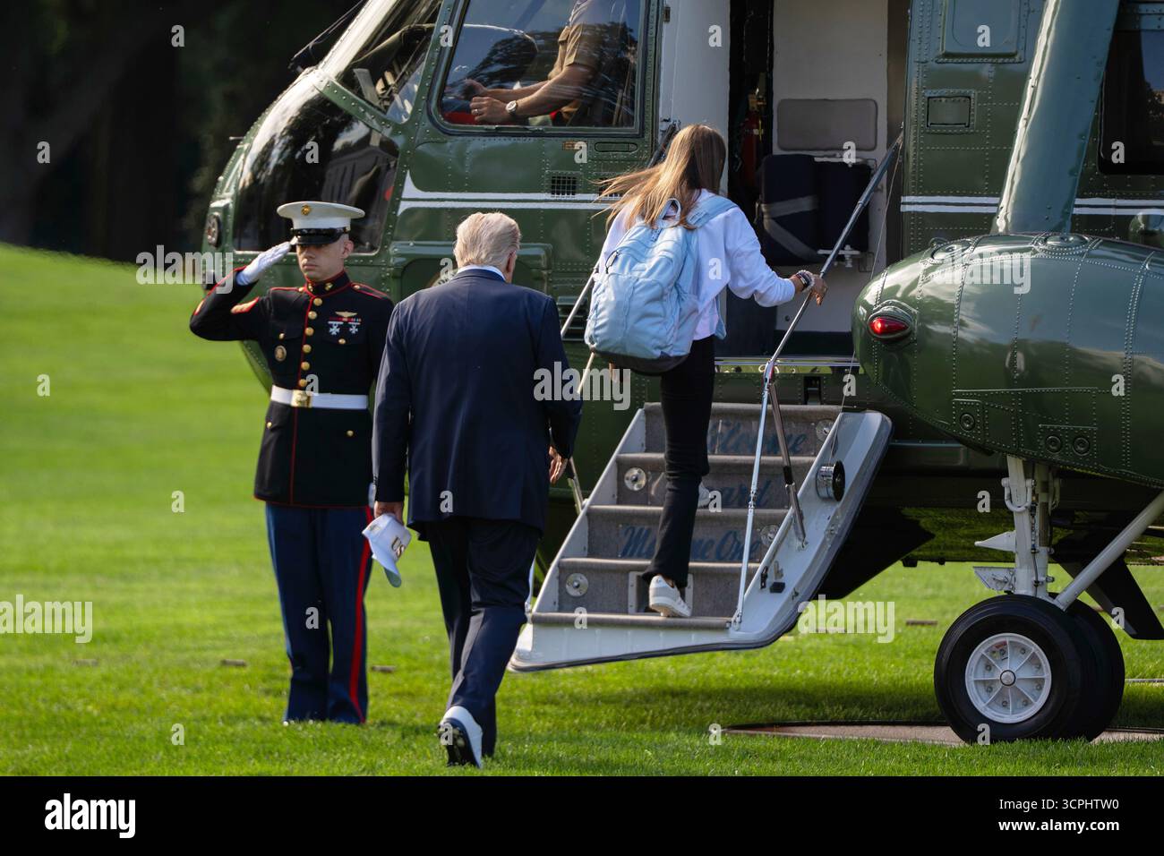 President Donald Trump, left, and granddaughter Kai Trump board Marine ...