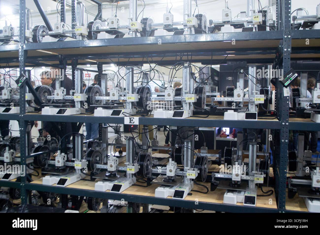 Kyiv, Ukraine, May 25, 2025: Many 3D printers printing an object. 3D ...