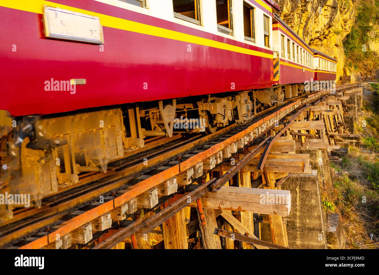 A passenger diesel locomotive train,carrying tourists,moving slowly and ...