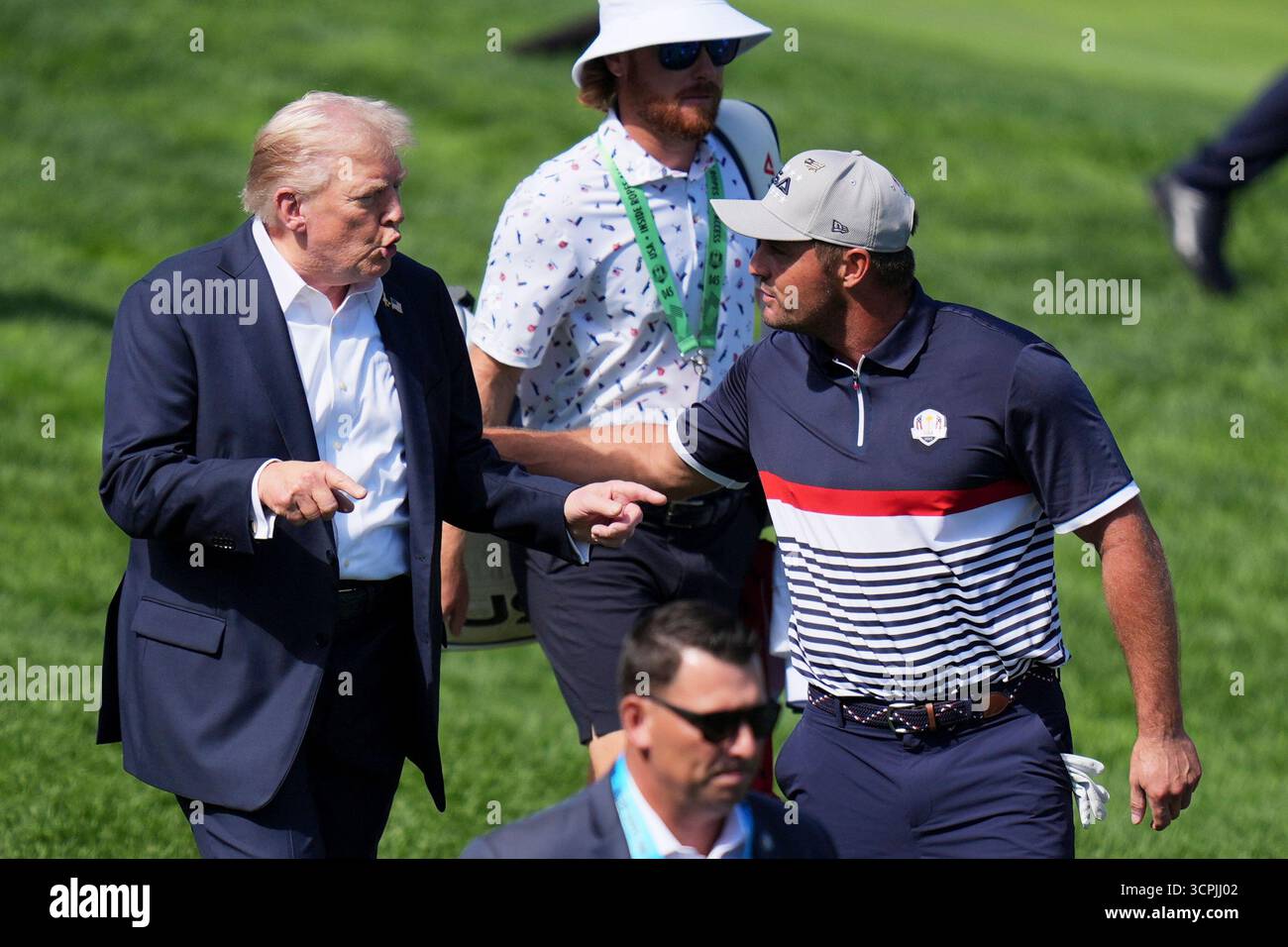 President Donald Trump greets United States' Bryson DeChambeau on the ...