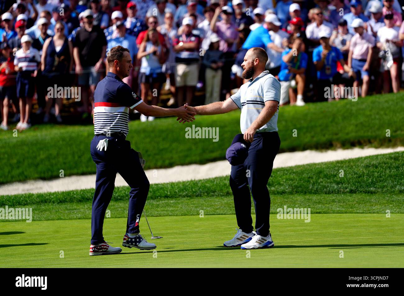 Tyrrell Hatton of Team Europe with Justin Thomas of Team United States ...