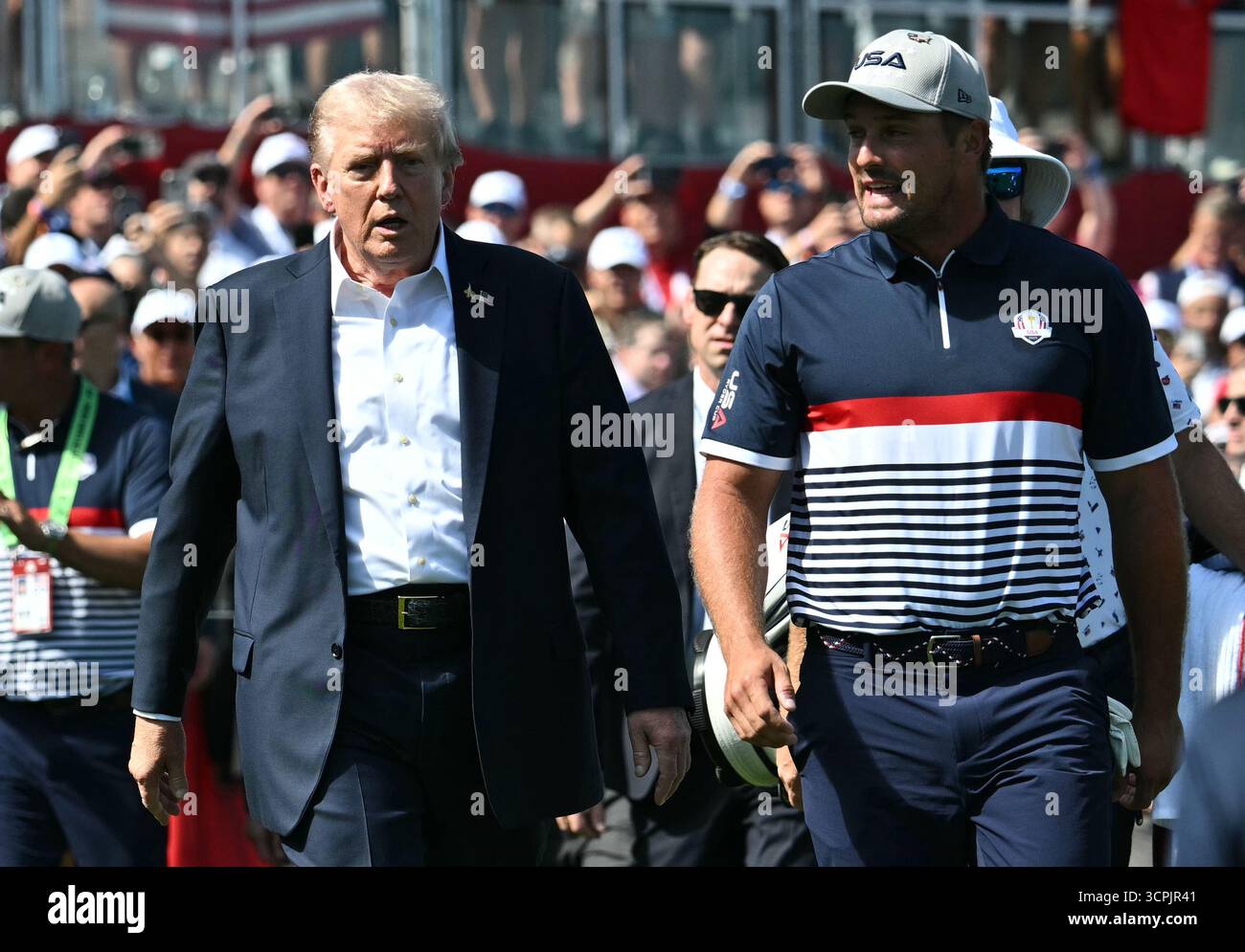 President Donald Trump, left, walks walks with United States' Bryson ...