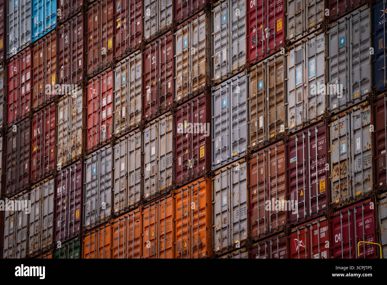 Cargo containers are seen stacked on the Hapag-Lloyd container ship ...
