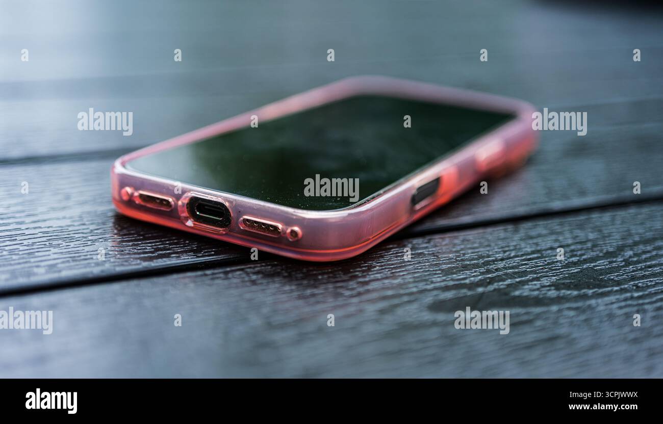 Angled smartphone showing charging and speaker ports Stock Photo - Alamy
