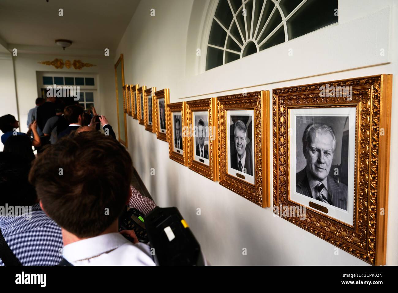 Presidential portraits are pictured on the Presidential Walk of Fame on ...