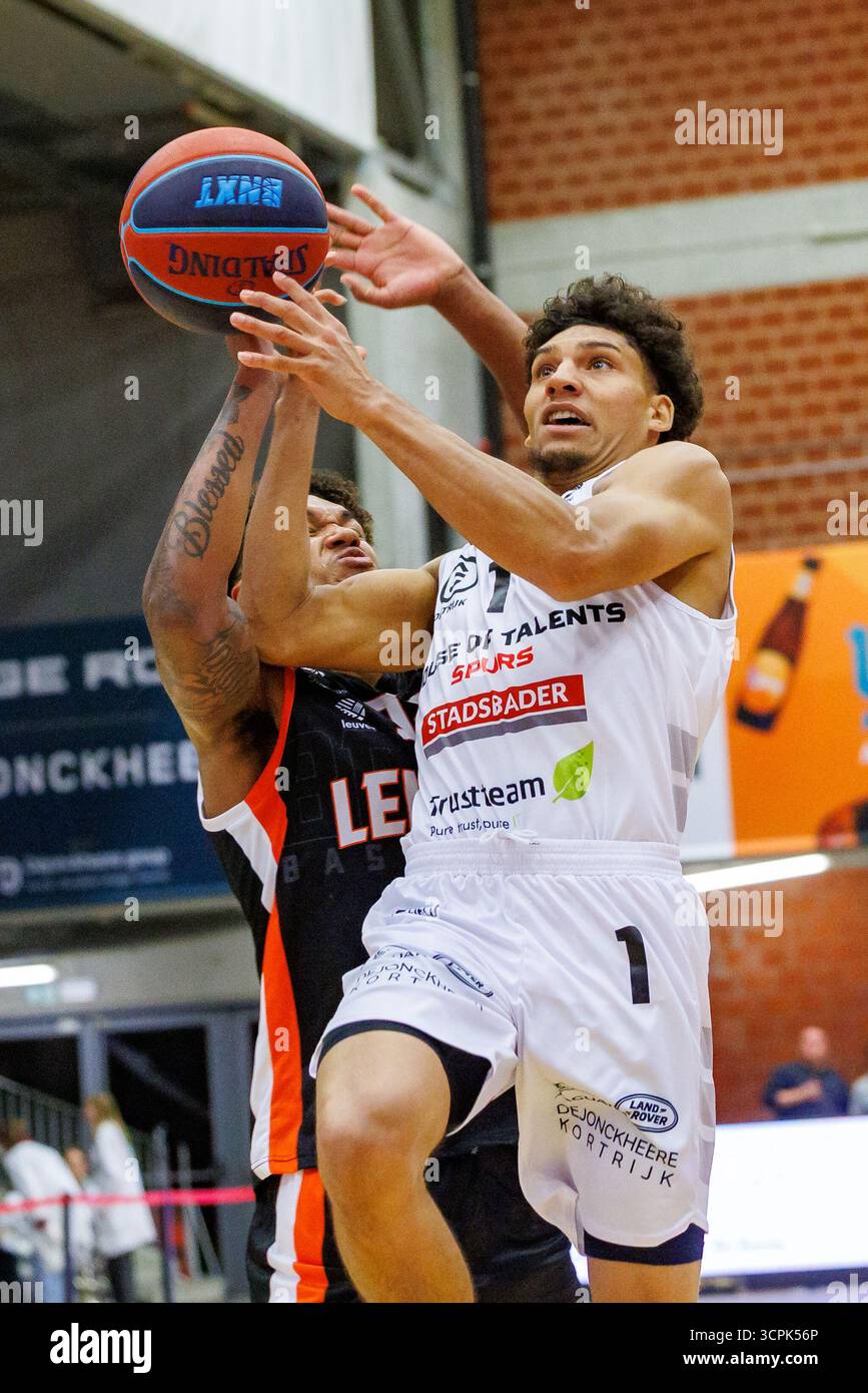 Leuven's Tylan Anderson and Kortrijk's Diego Bernard fight for the ball ...