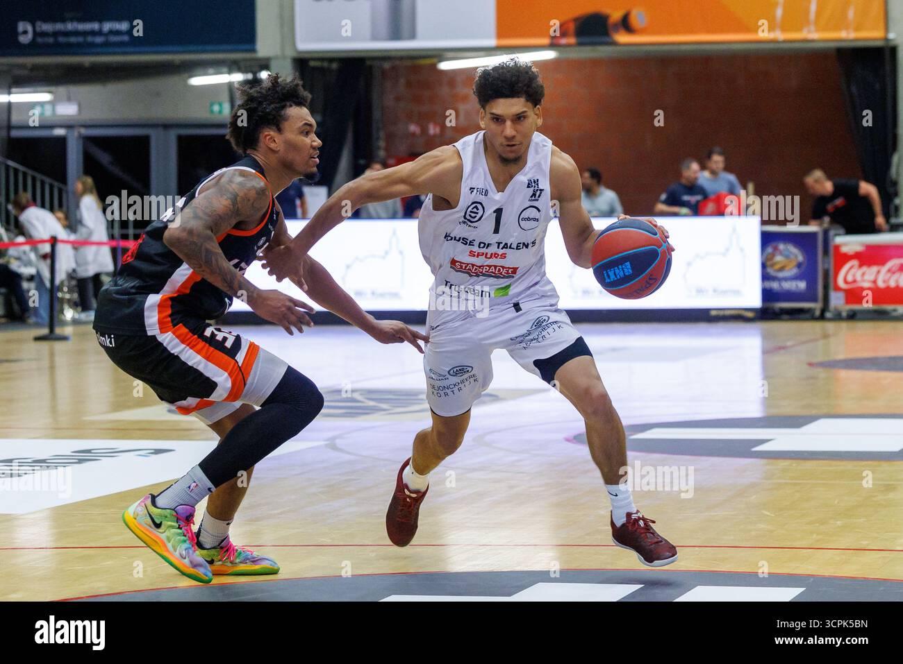 Leuven's Tylan Anderson and Kortrijk's Diego Bernard fight for the ball ...