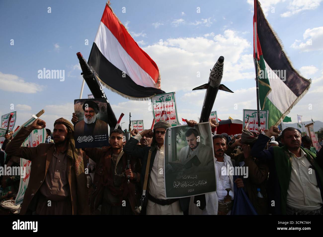 A Houthi supporter holds a mock rocket during an anti-Israel protest in ...