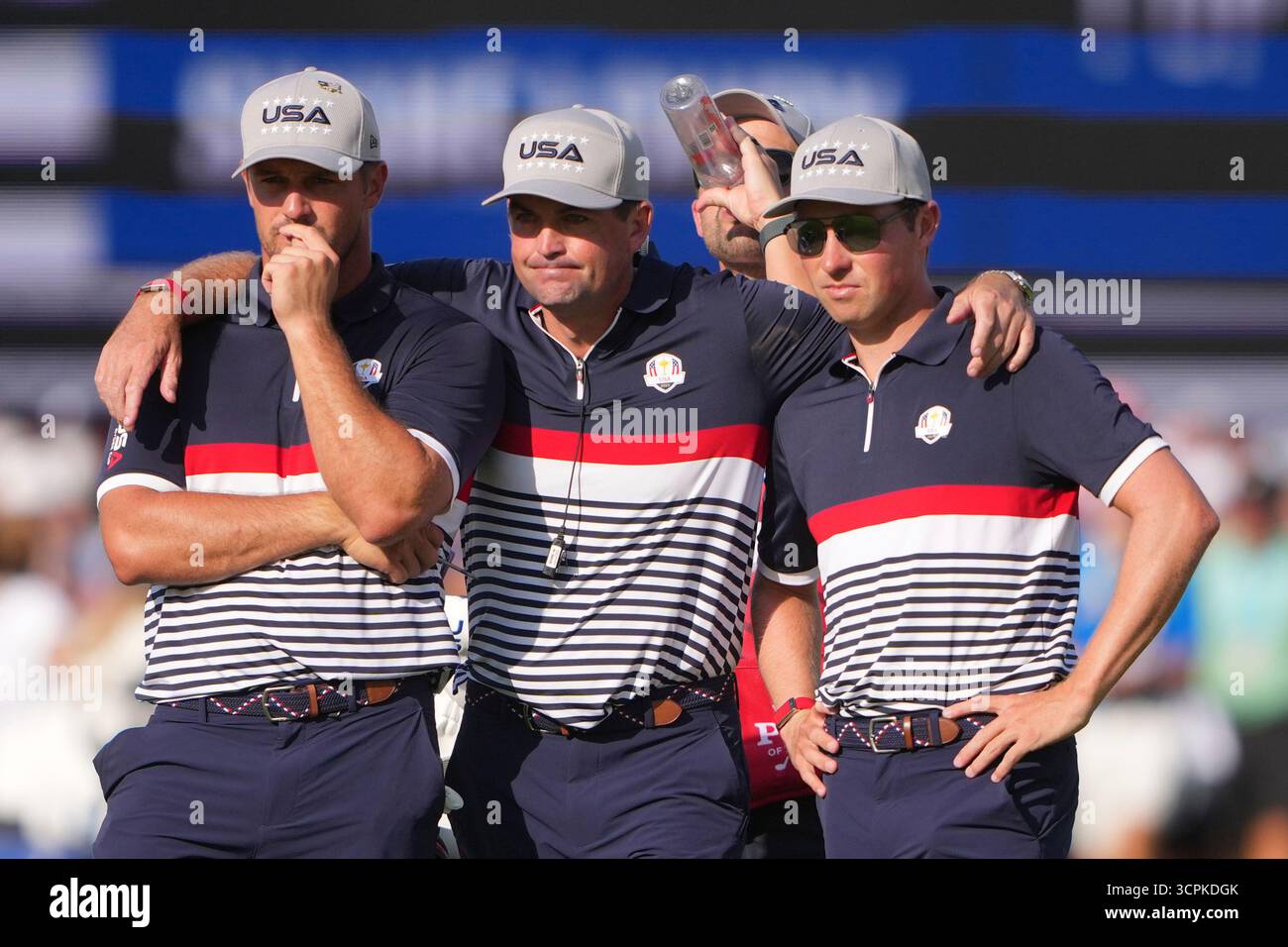 United States captain Keegan Bradley, middle, stands with Bryson ...