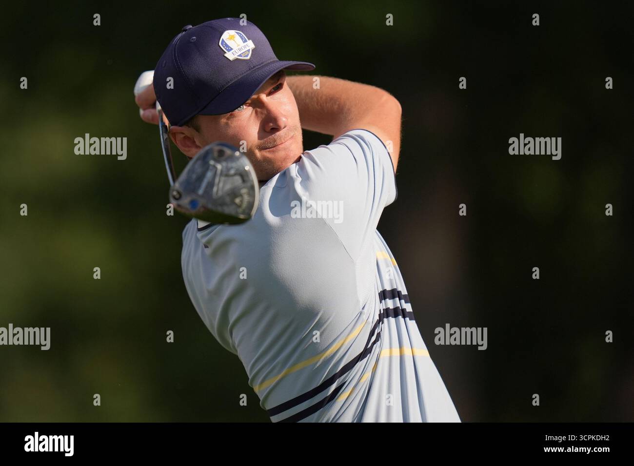 Europe's Rasmus Højgaard watches his tee shot on the 12th hole at ...