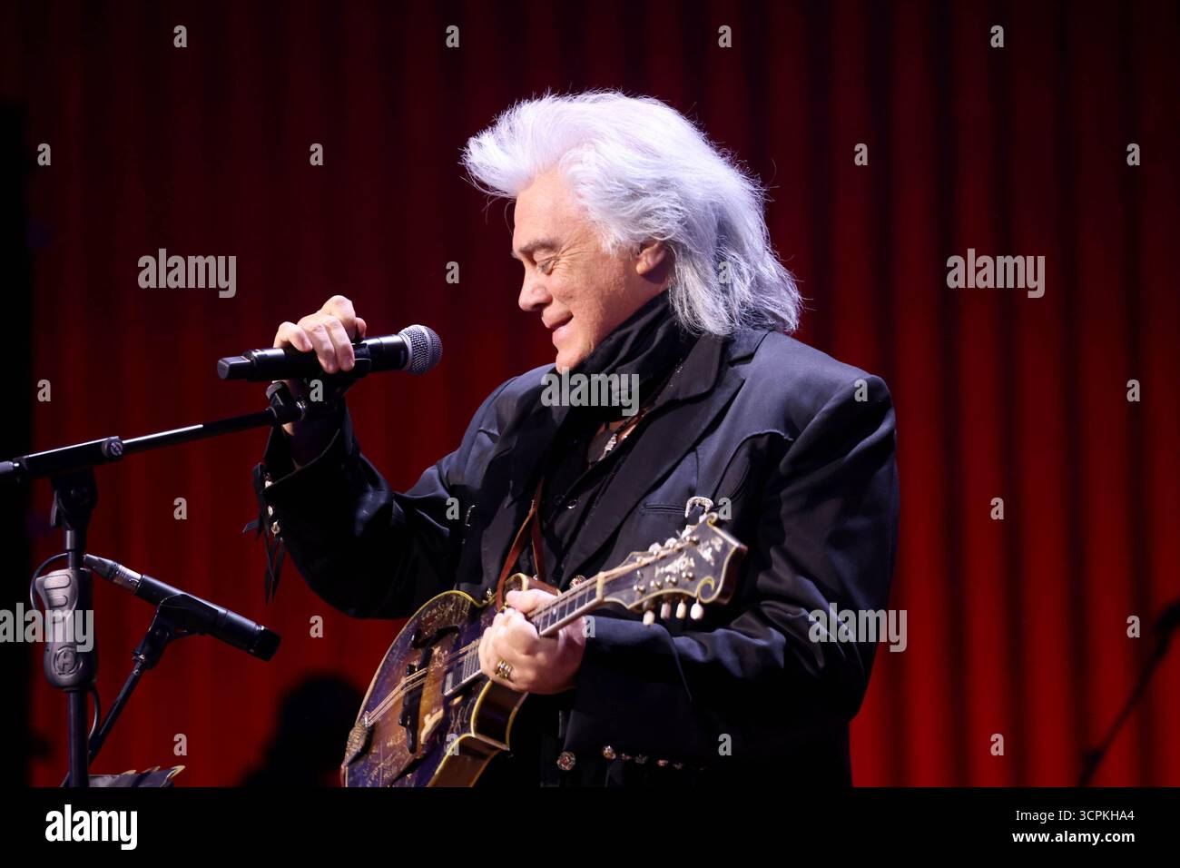 EDITORIAL USE ONLY Marty Stuart performs during Grand Ole Opry: Live in ...