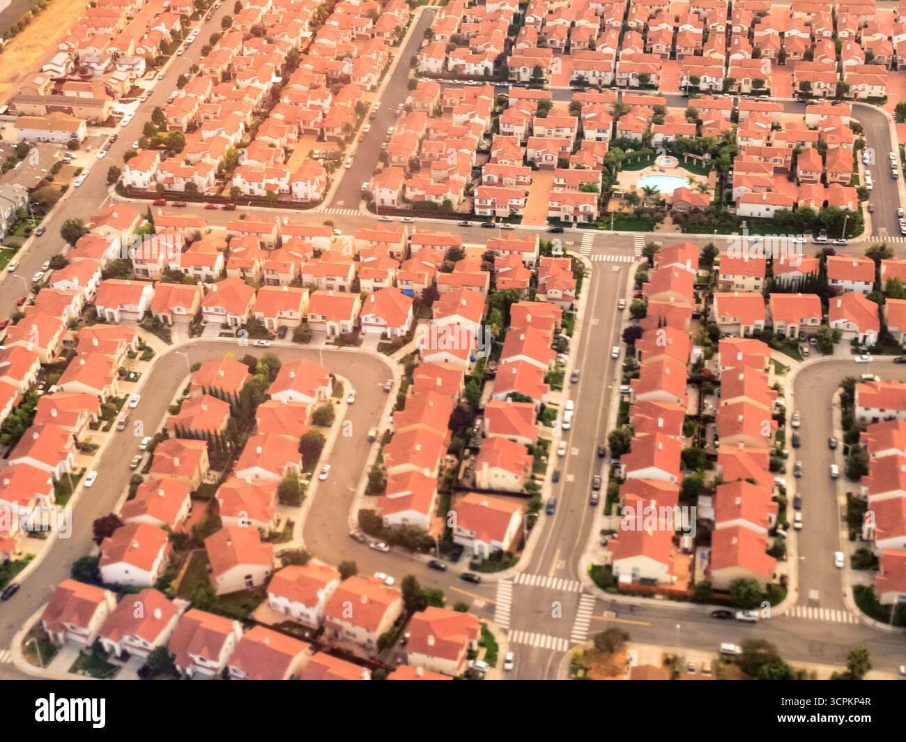 An aerial view shows a densely packed suburban neighborhood with ...