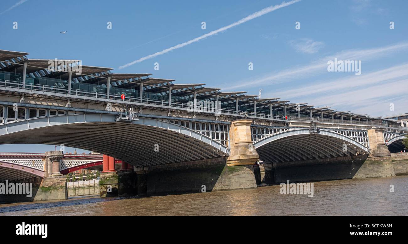 LONDON, ENGLAND - Aug 28, 2025: Hungerford Bridge and its pedestrian ...