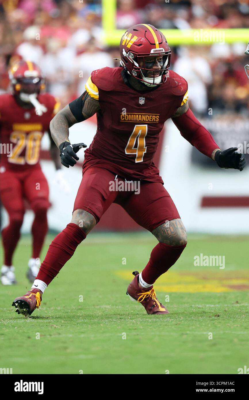 Washington Commanders linebacker Frankie Luvu (4) rushes during an NFL ...