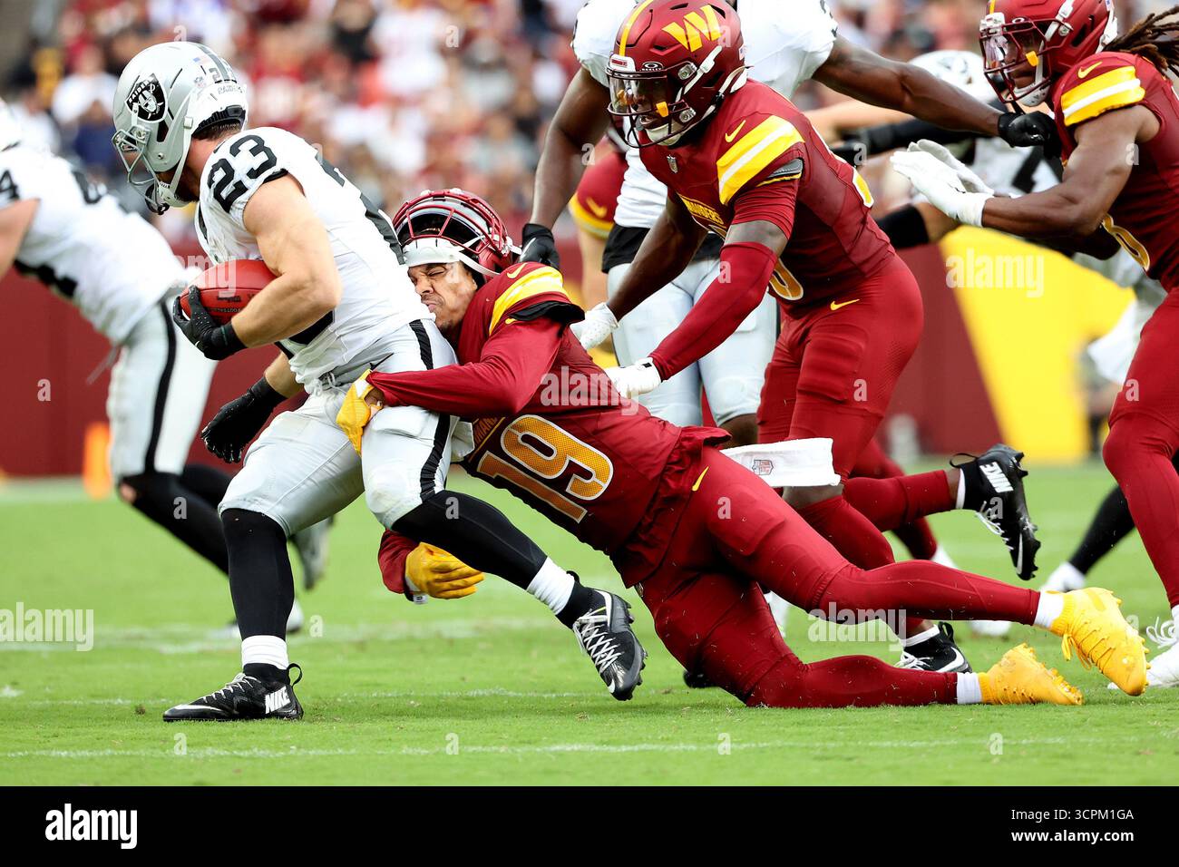 Washington Commanders wide receiver Chris Moore (19) takes down Las ...