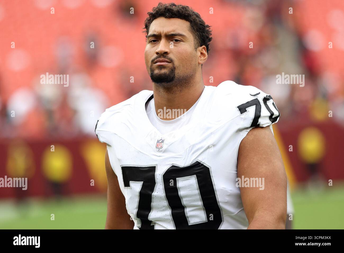 Las Vegas Raiders offensive tackle Stone Forsythe (70) looks on after ...