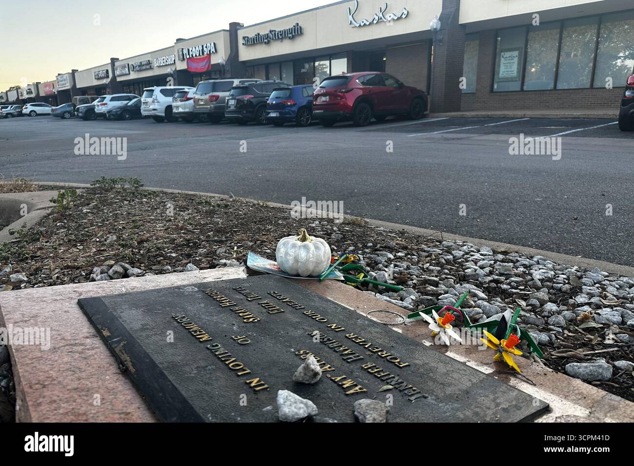 Tributes lay on a memorial Friday, Sept. 26, 2025, for four teenage ...