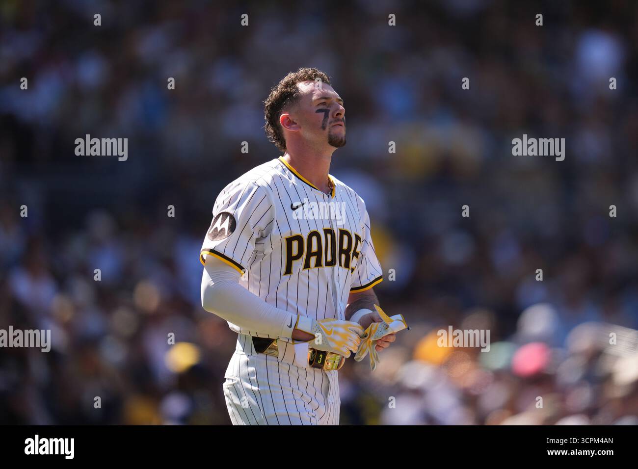 San Diego Padres' Jackson Merrill walks on the field between innings of ...