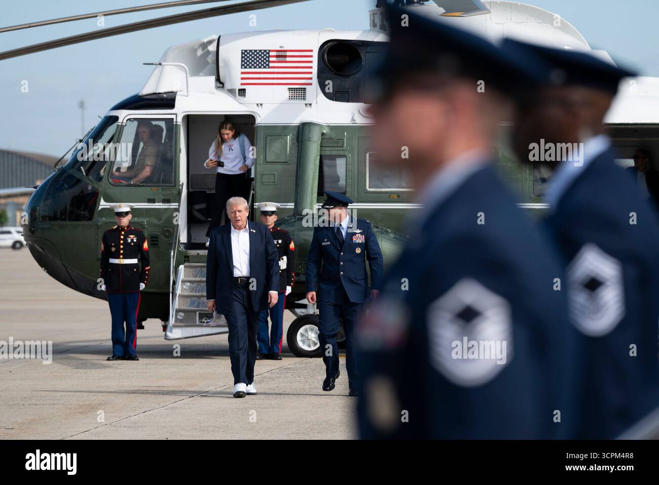 President Donald Trump disembarks Marine One at Joint Base Andrews, Maryland on Friday ...