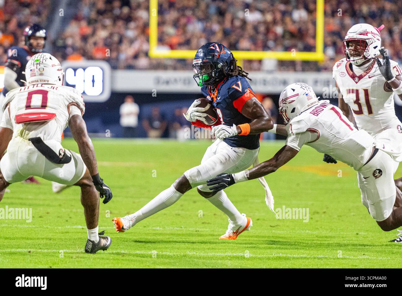 Virginia wide receiver Cam Ross (6) runs the ball downfield during the ...