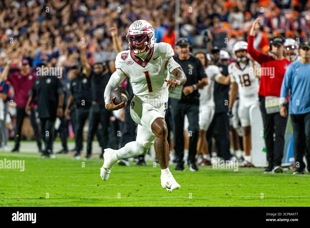 Florida State quarterback Tommy Castellanos (1) runs the ball downfield ...