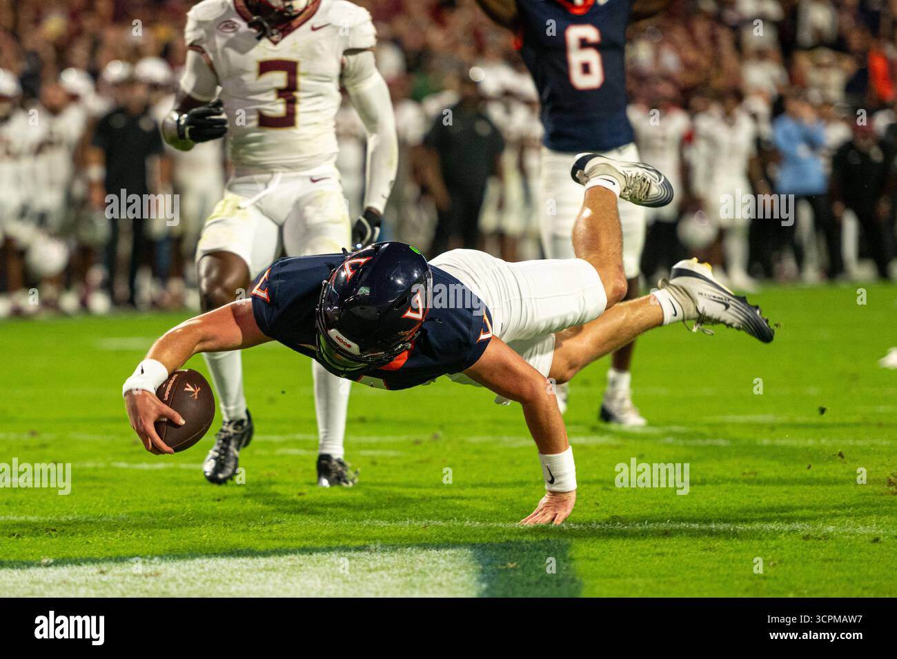 Virginia quarterback Chandler Morris (4) runs the ball in for a ...