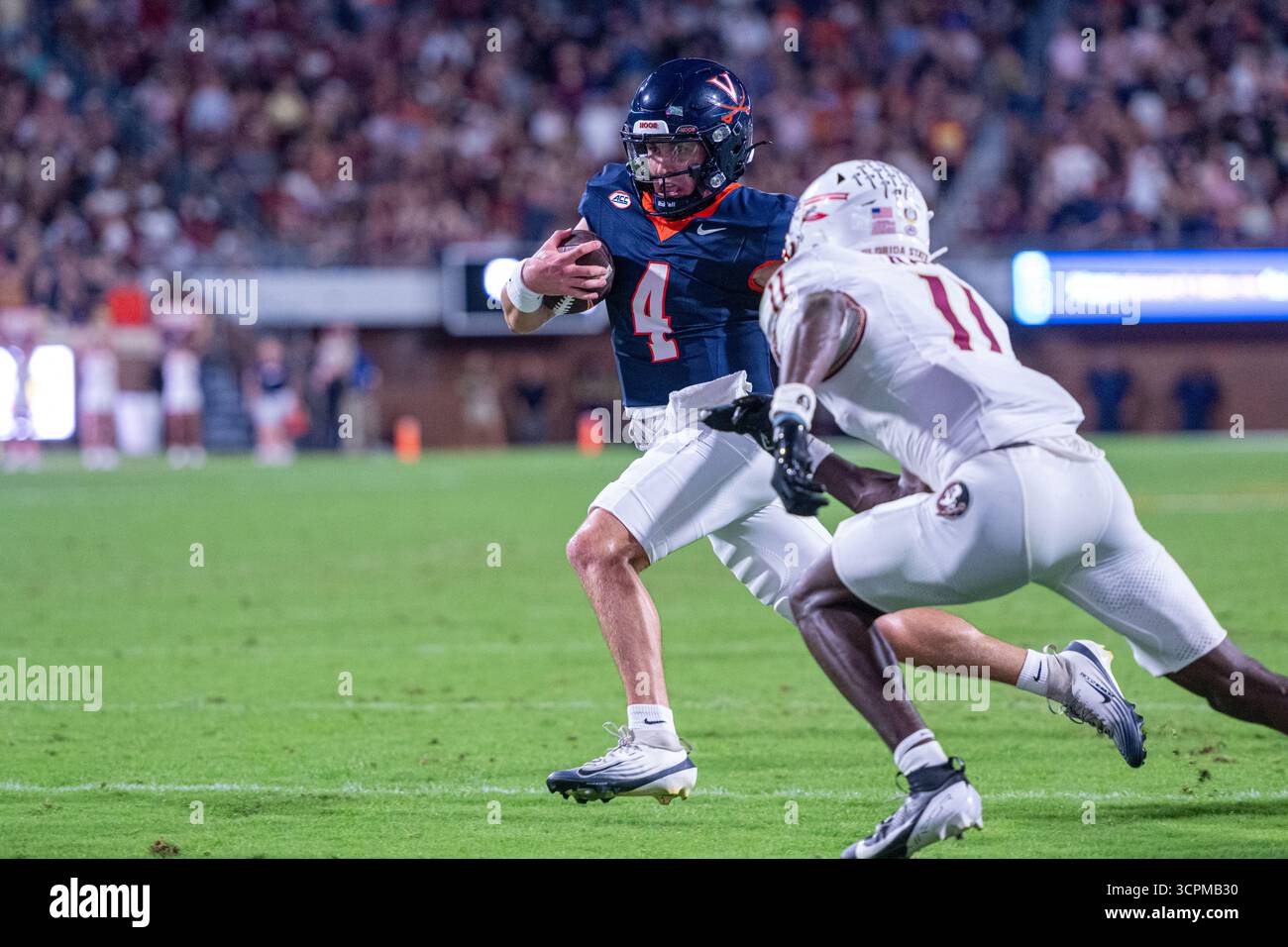 Virginia quarterback Chandler Morris (4) runs the ball in for a ...