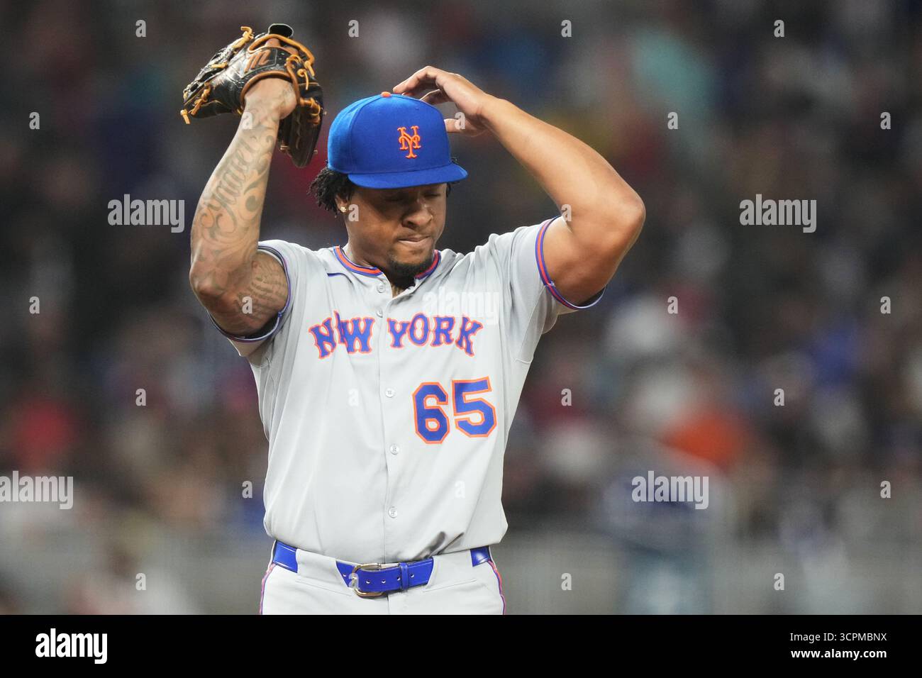 New York Mets relief pitcher Gregory Soto (65) reacts after giving up a ...