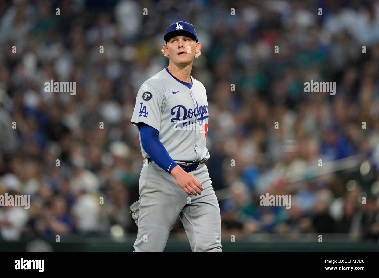 Los Angeles Dodgers starting pitcher Emmet Sheehan reacts while walking ...