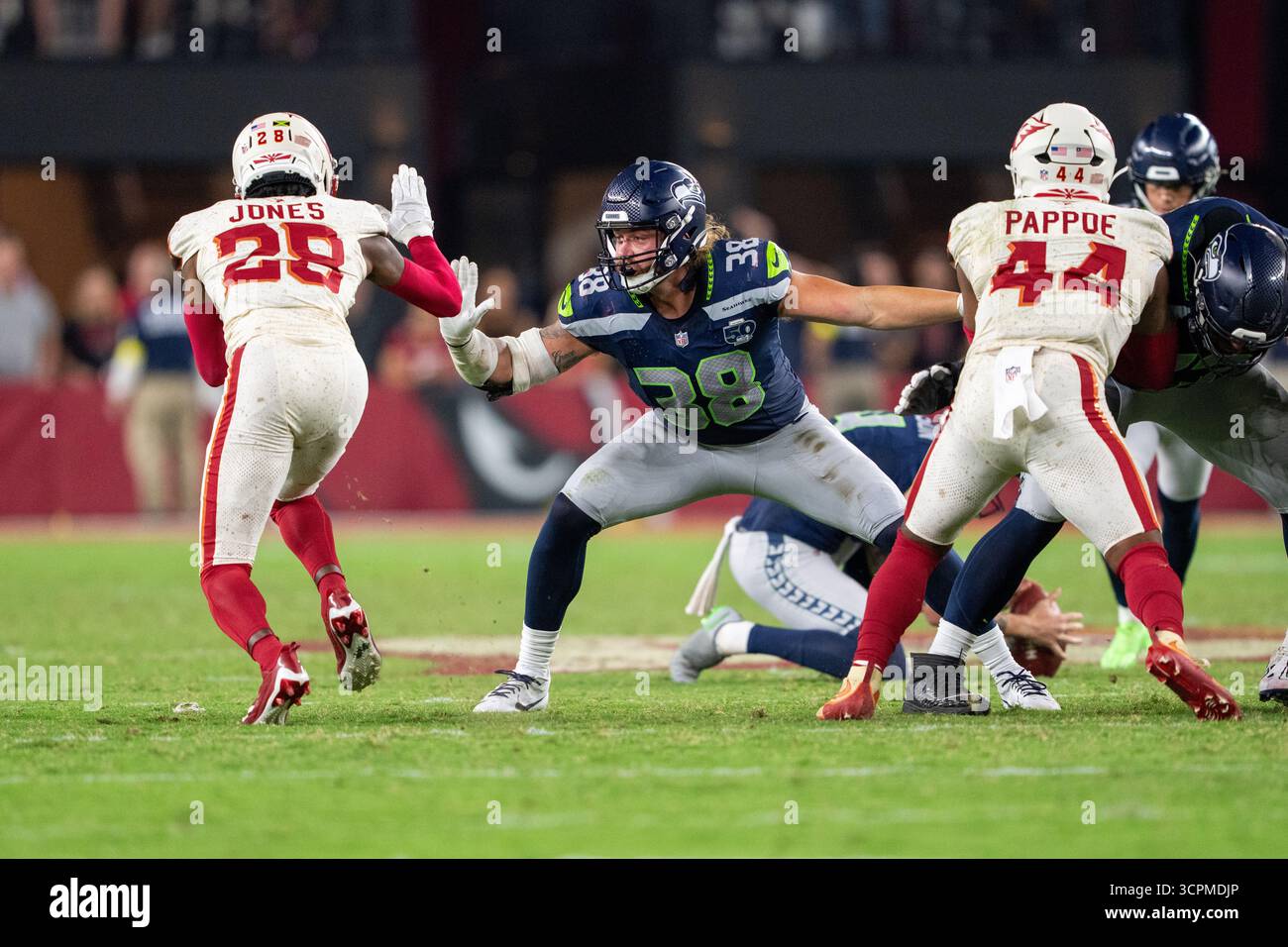 Seattle Seahawks fullback Brady Russell (38) holds off Arizona ...