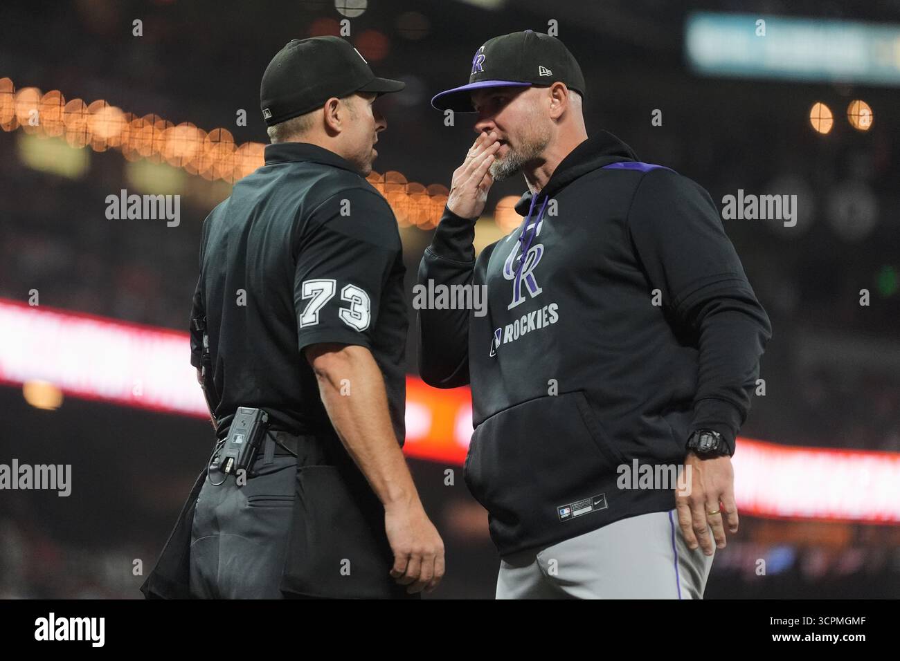 Umpire Tripp Gibson (73) talks with Colorado Rockies interim manager ...