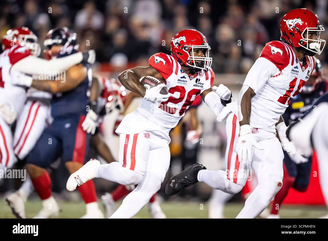Calgary Stampeders' running back Dedrick Mills (26) runs the ball ...