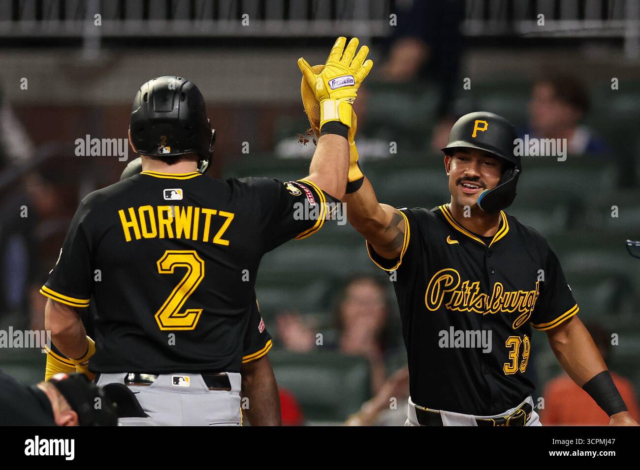Pittsburgh Pirates' Spencer Horwitz (2) high-fives Nick Gonzales (39 ...