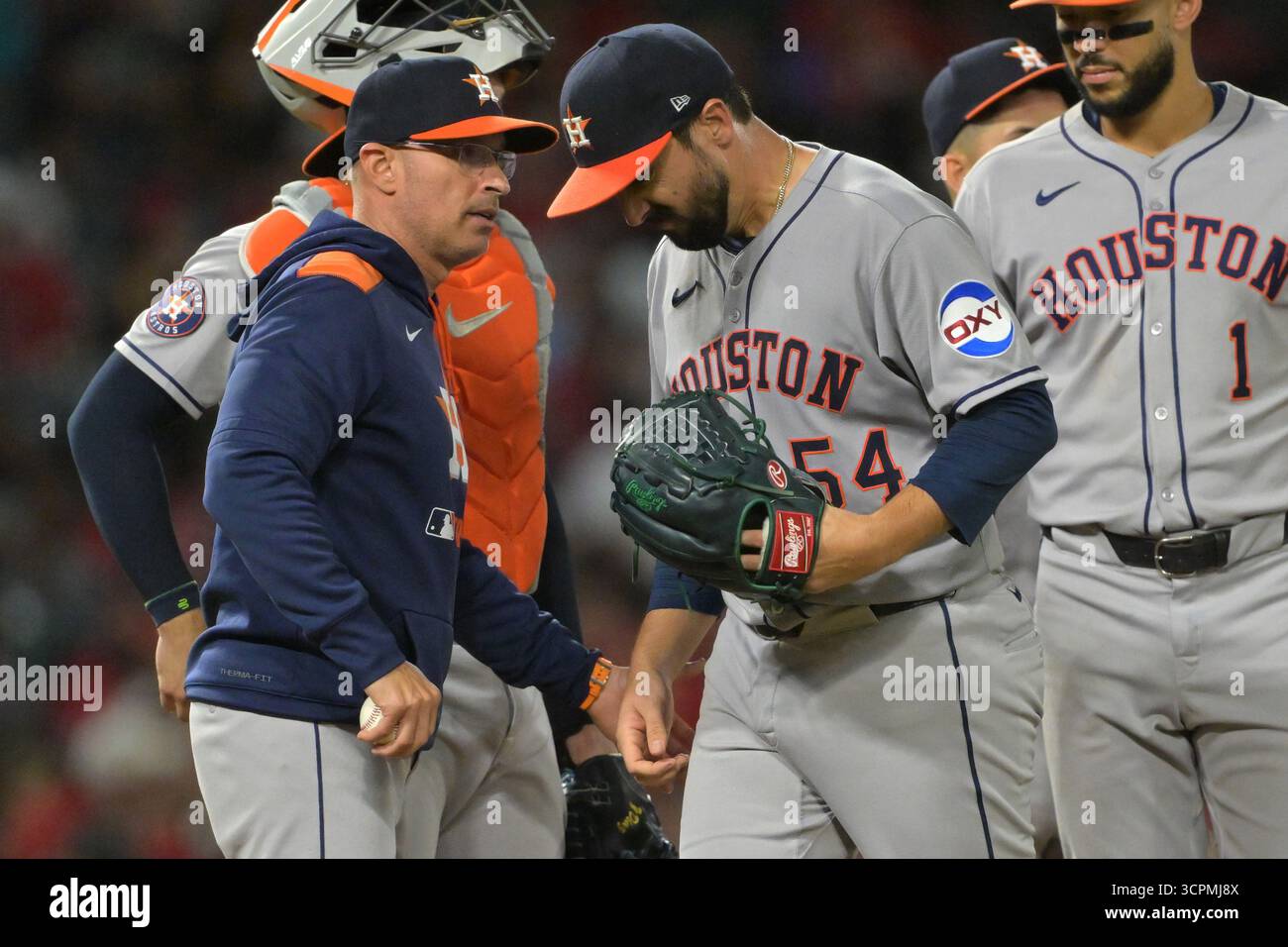 Houston Astros manager Joe Espada, left pulls Astros' starting pitcher ...