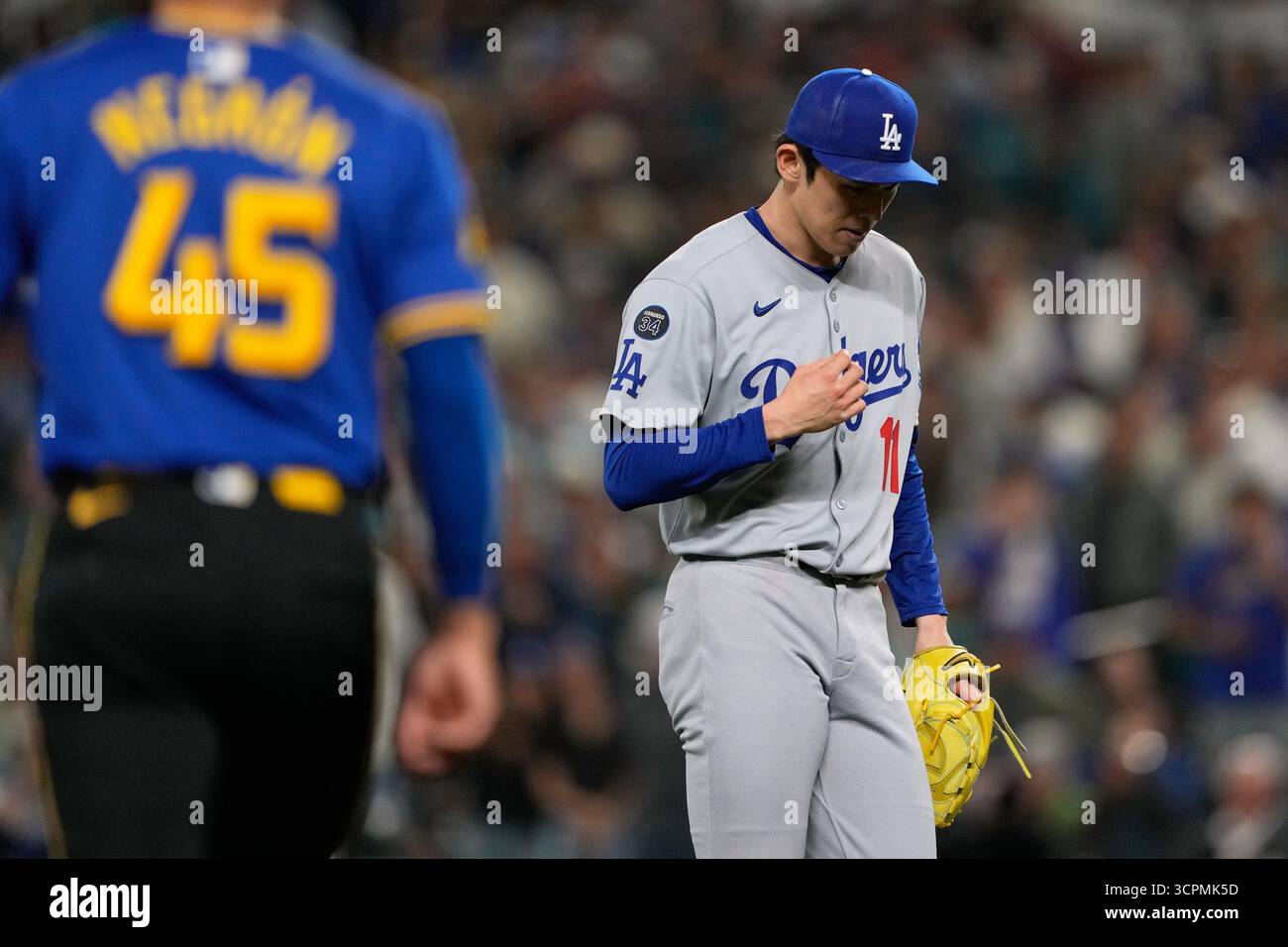 Los Angeles Dodgers relief pitcher Roki Sasaki reacts after the seventh ...