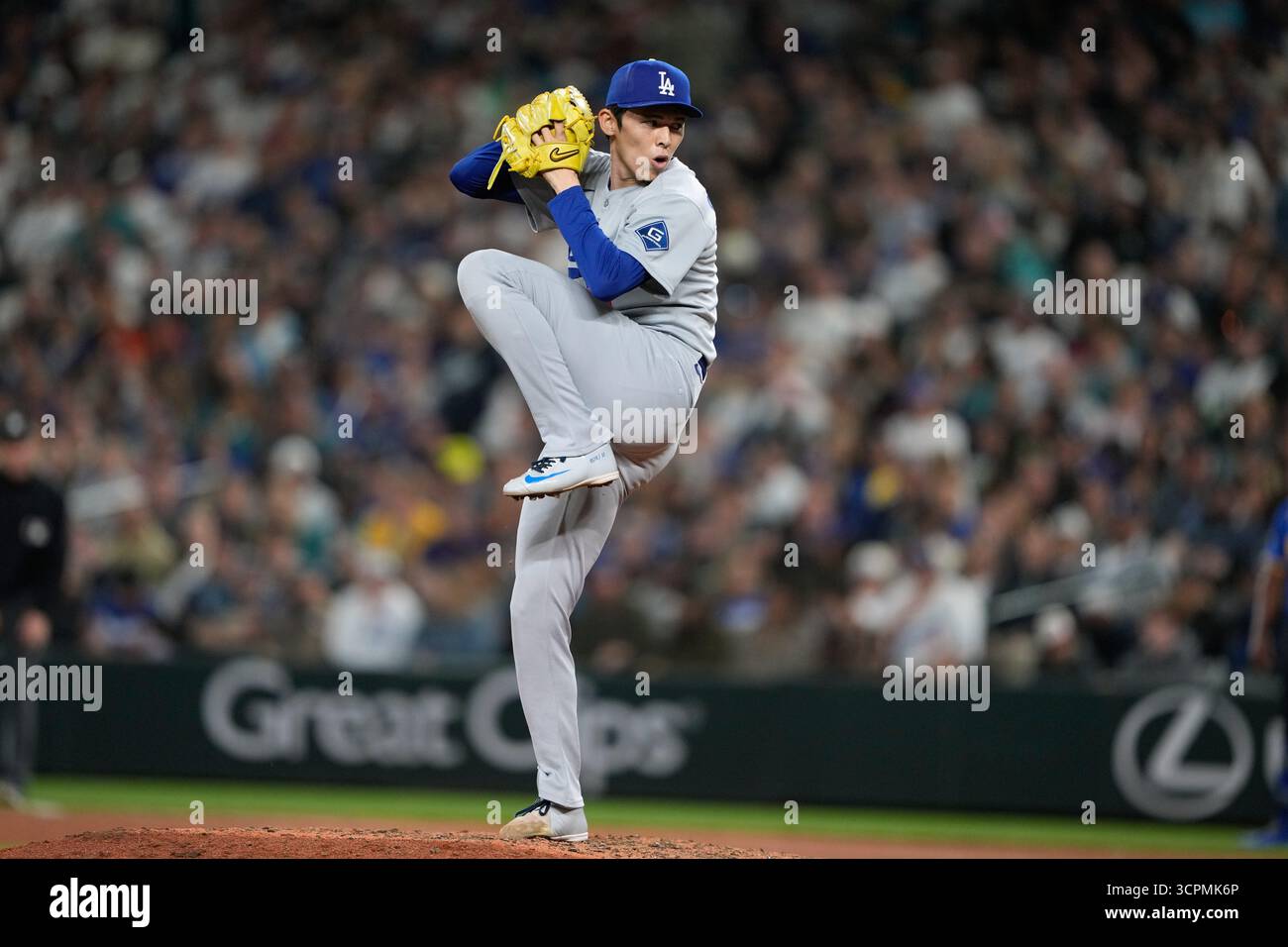 Los Angeles Dodgers relief pitcher Roki Sasaki delivers a pitch during ...