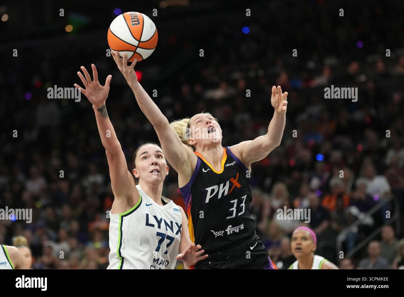 Phoenix Mercury guard Sami Whitcomb (33) drives past Minnesota Lynx ...