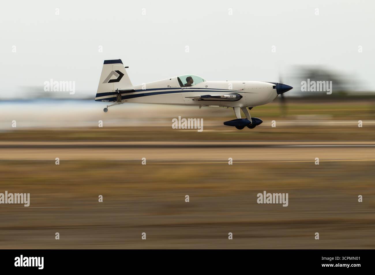 Aaron Deliu in an Extra 330 aircraft performing maneuvers during the ...