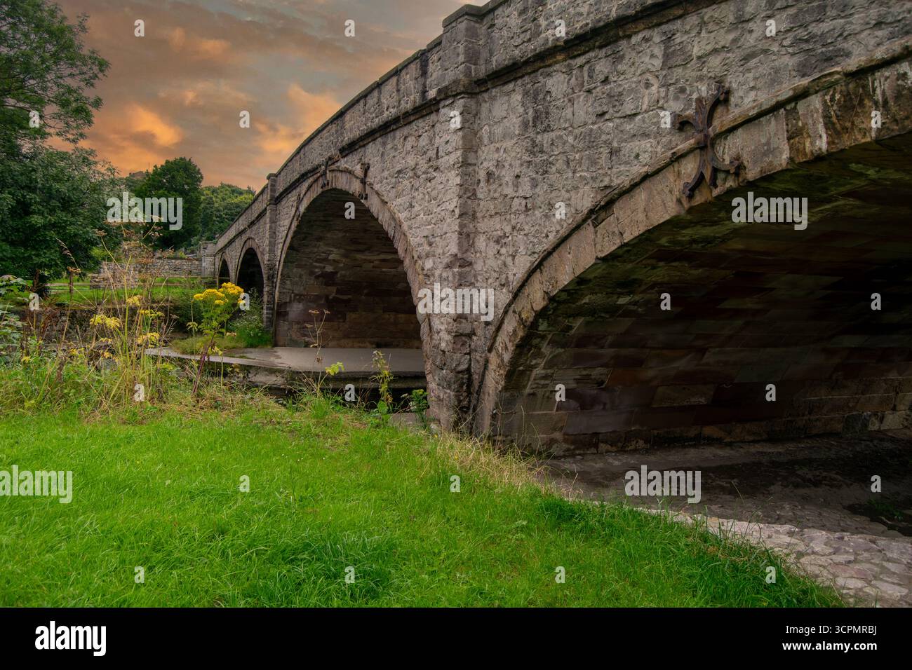 Historic Elwy Bridge stone arch crossing over the River Elwy in St ...
