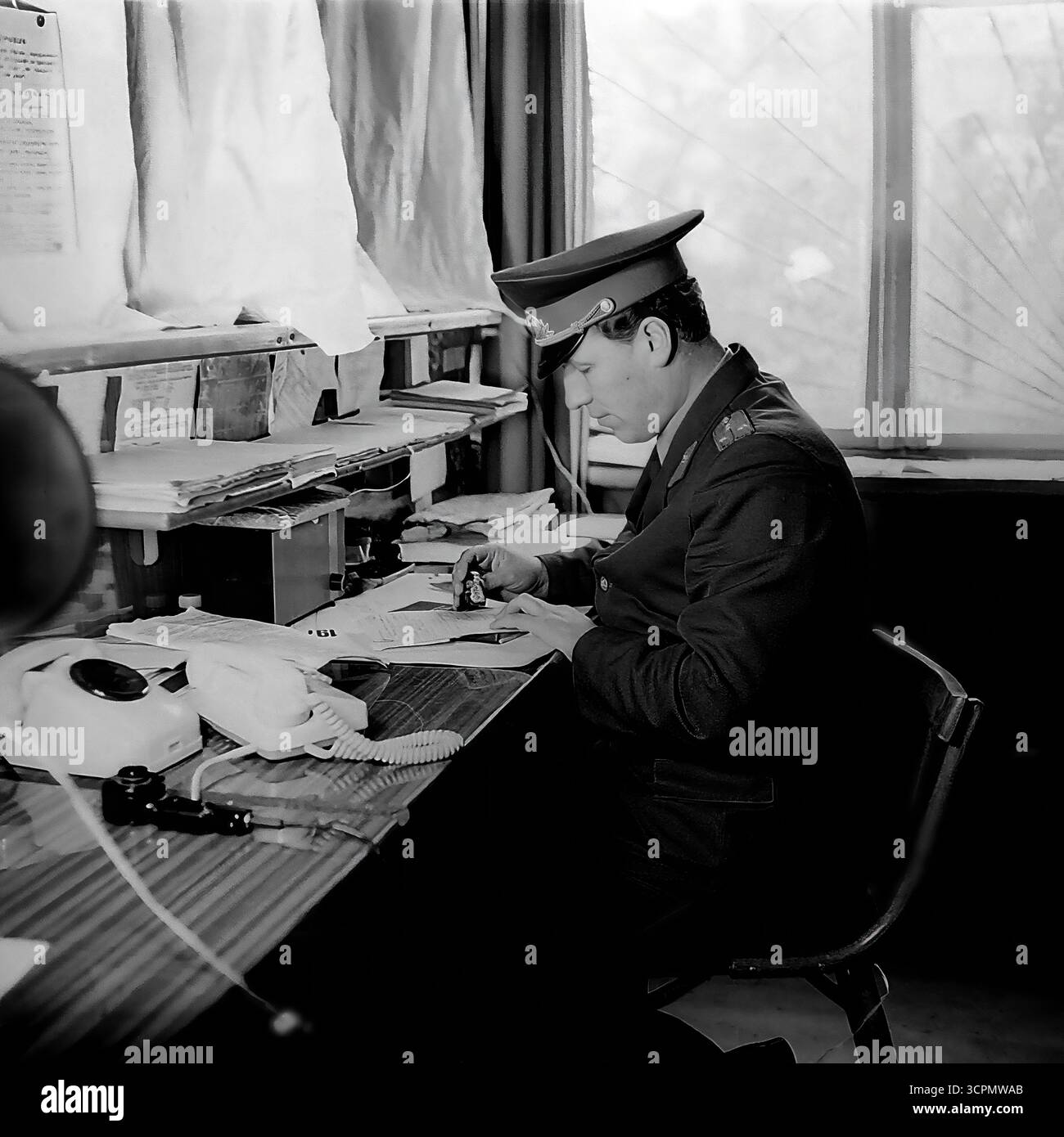 A Soviet GAI (State Automobile Inspectorate) officer is captured in a ...