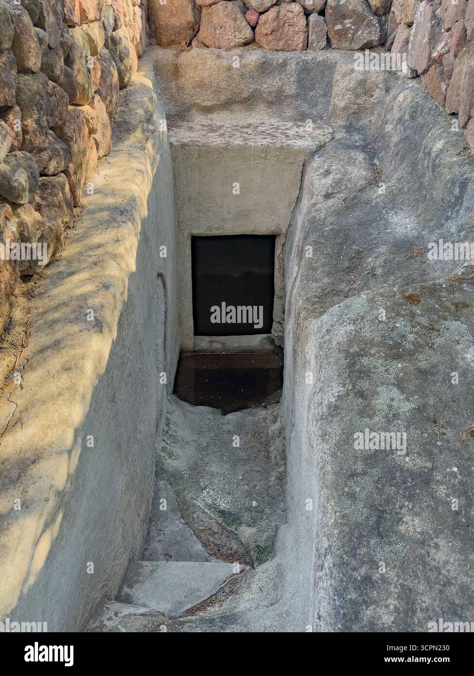 Prehistoric Domus de Janas rock cut tomb entrance at Monte Sirai ...