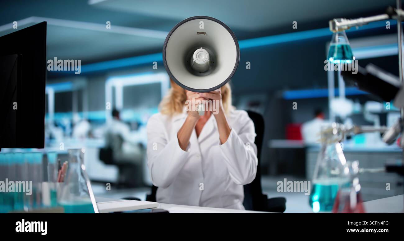Mature female doctor megaphone hi-res stock photography and images - Alamy
