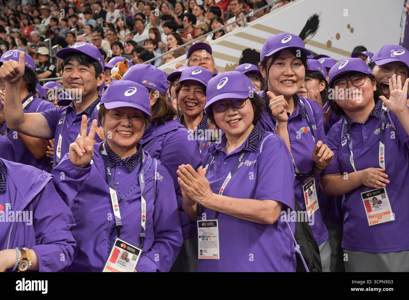 Volunteers celebrate there last night at the World Athletics ...