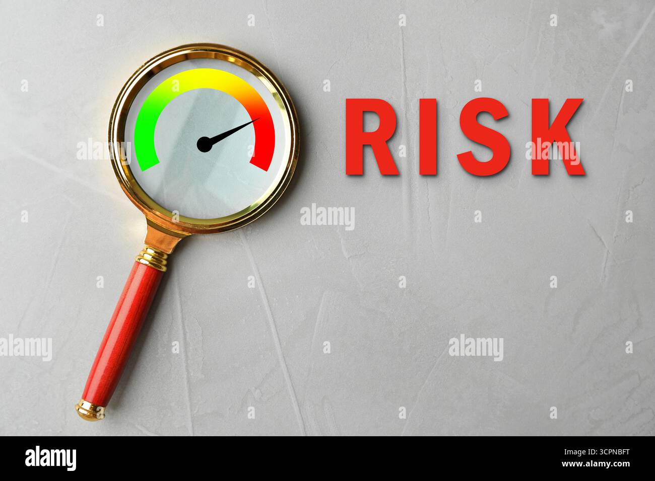 Risk word and magnifying glass with scale inside on grey background ...