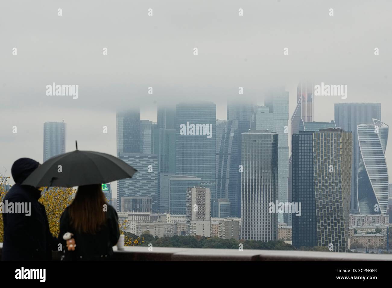 Clouds partially hide skyscrapers of the Moscow City business district ...