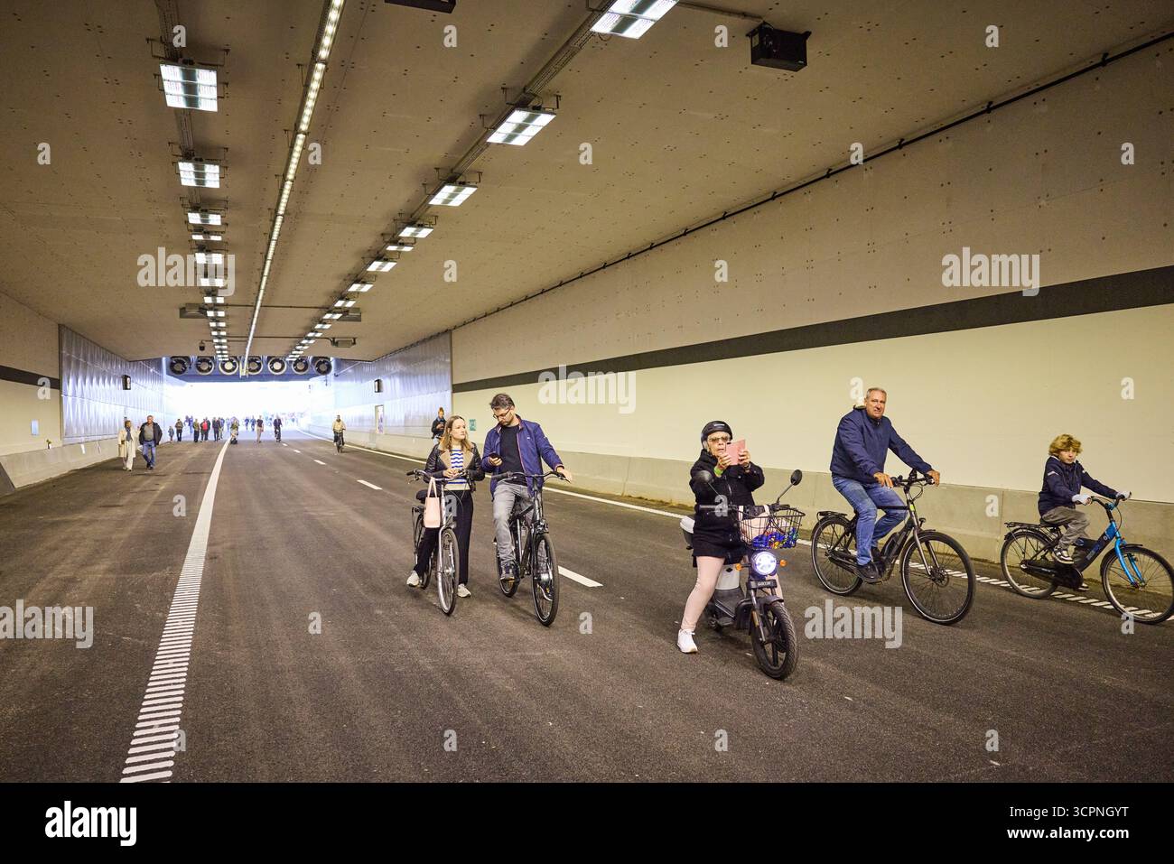 ROTTERDAM - Visitors walk and cycle through the Rottemeren Tunnel ...