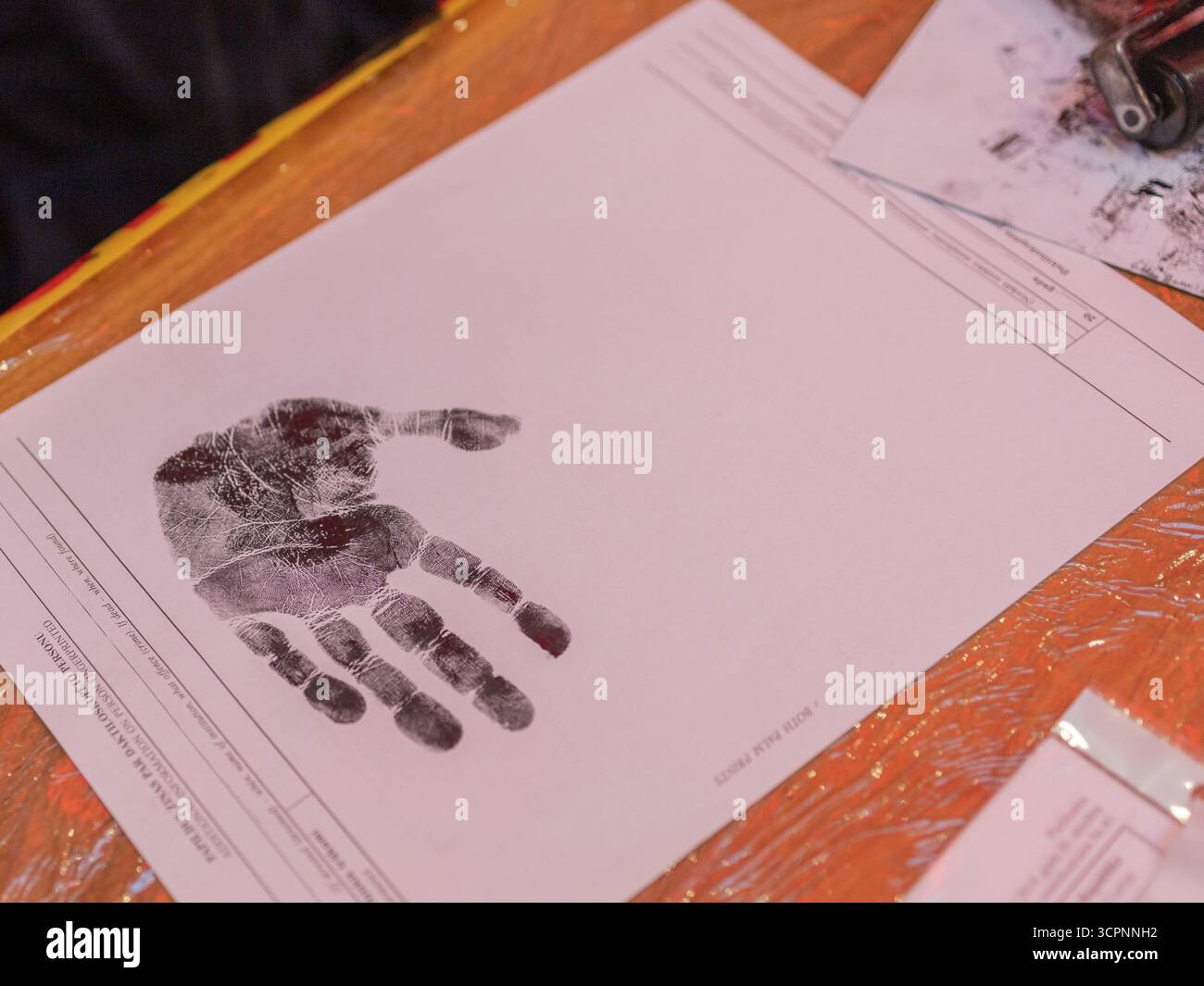 Taking of suspect's fingerprints in police department, close-up. Hand ...